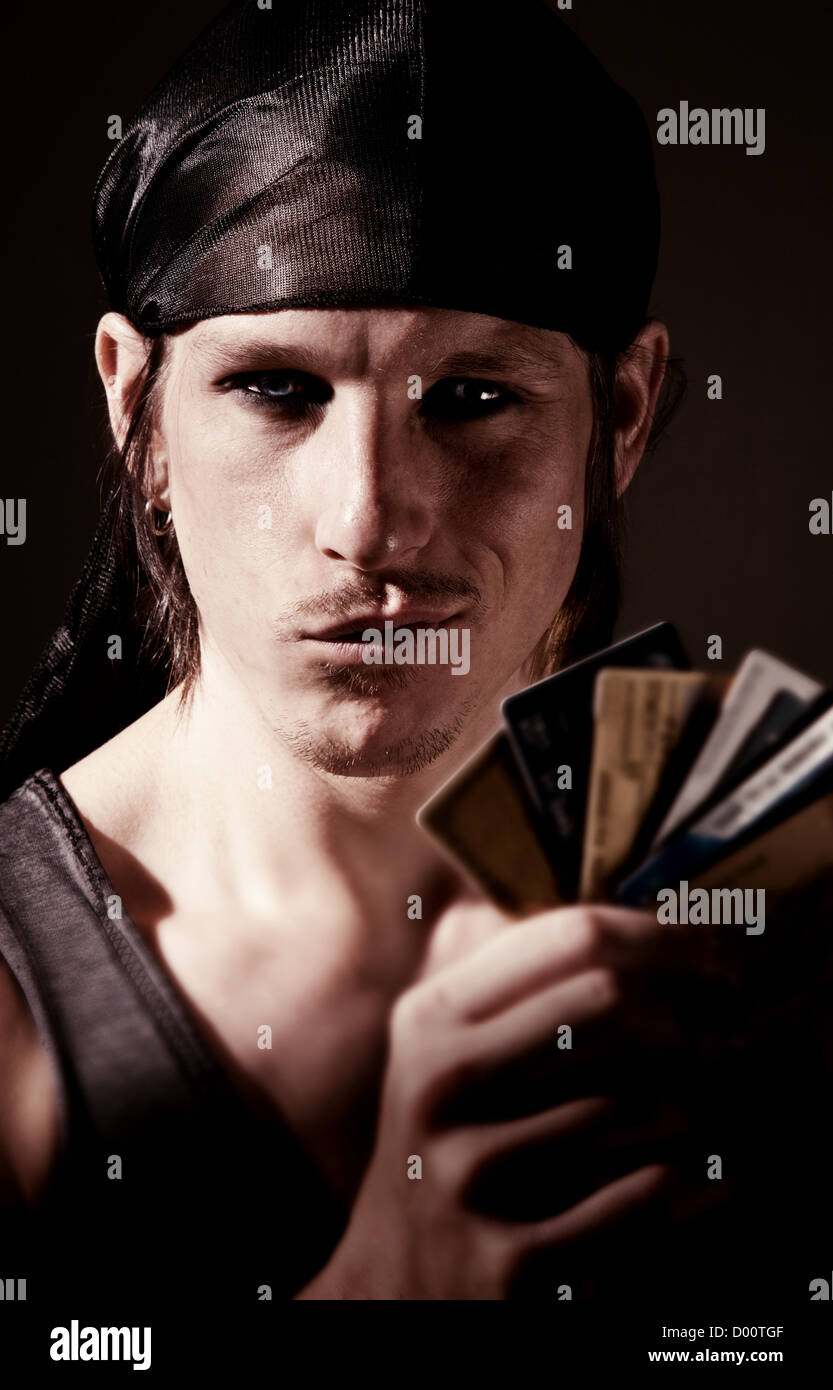 Thief with many stolen credit cards in his hand Stock Photo - Alamy