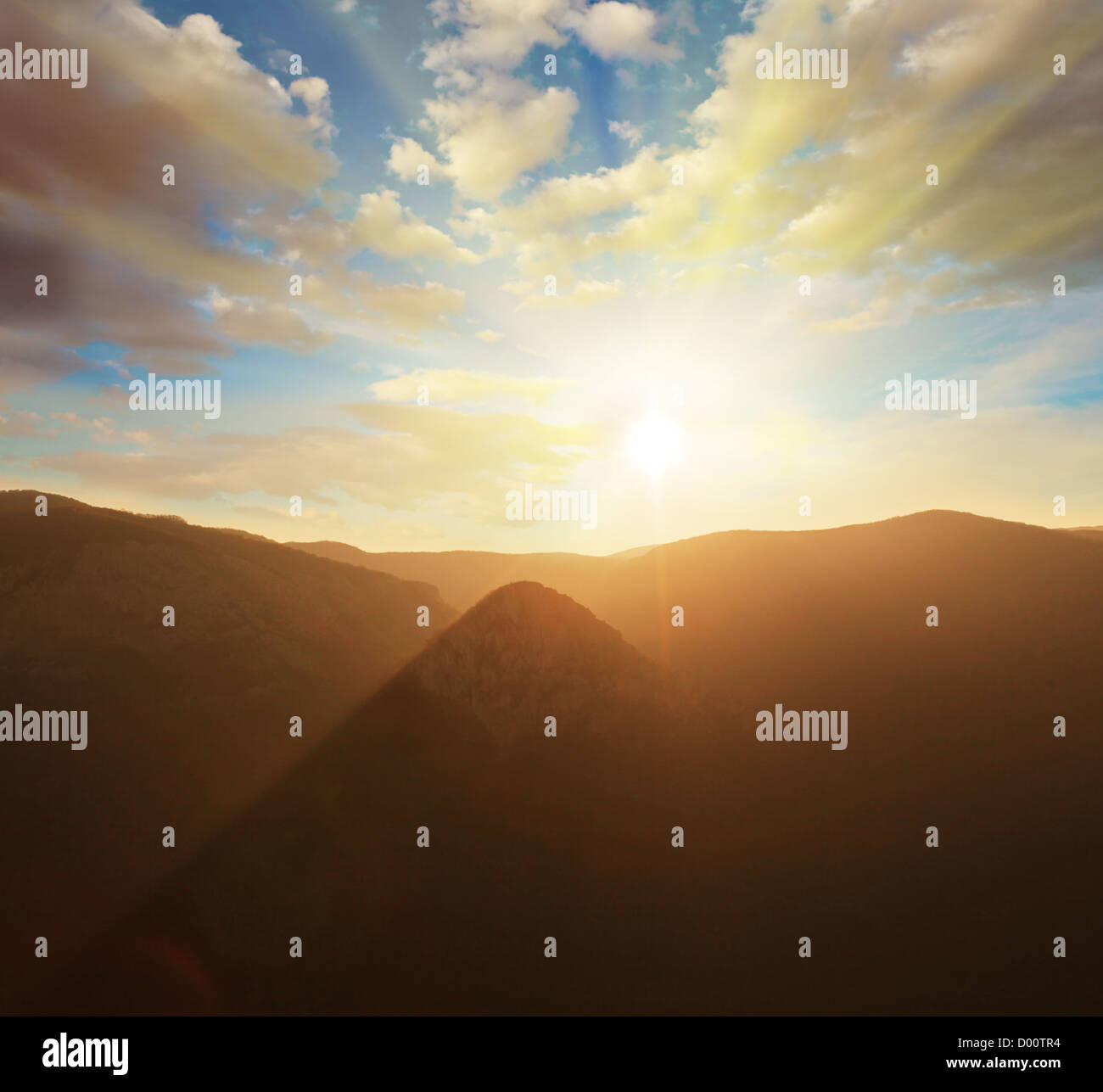 Sunset in mountains Stock Photo - Alamy