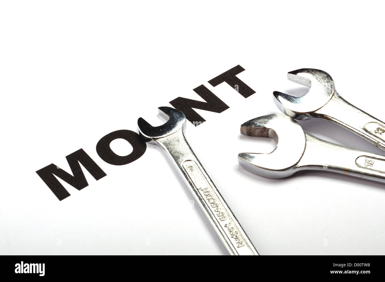mount or mounting concept with tool and word Stock Photo - Alamy