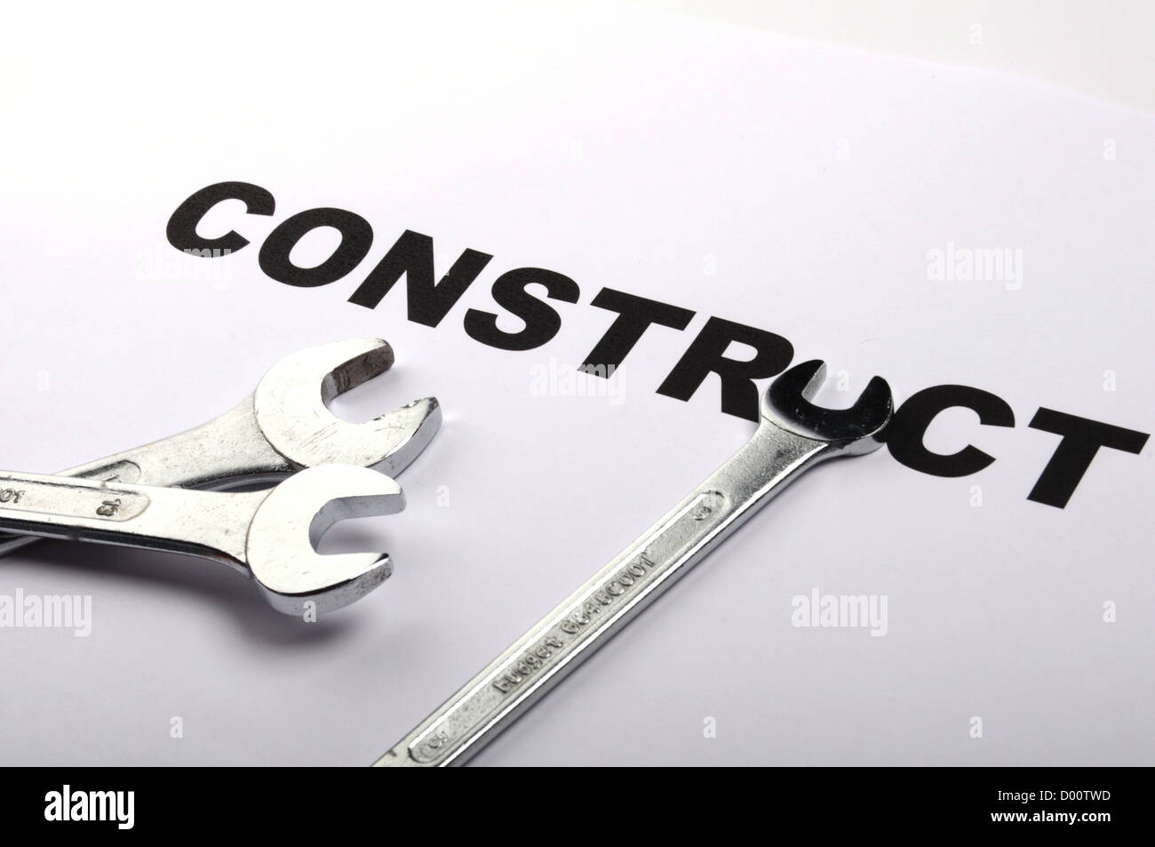 construct or construction concept with tool and word Stock Photo - Alamy