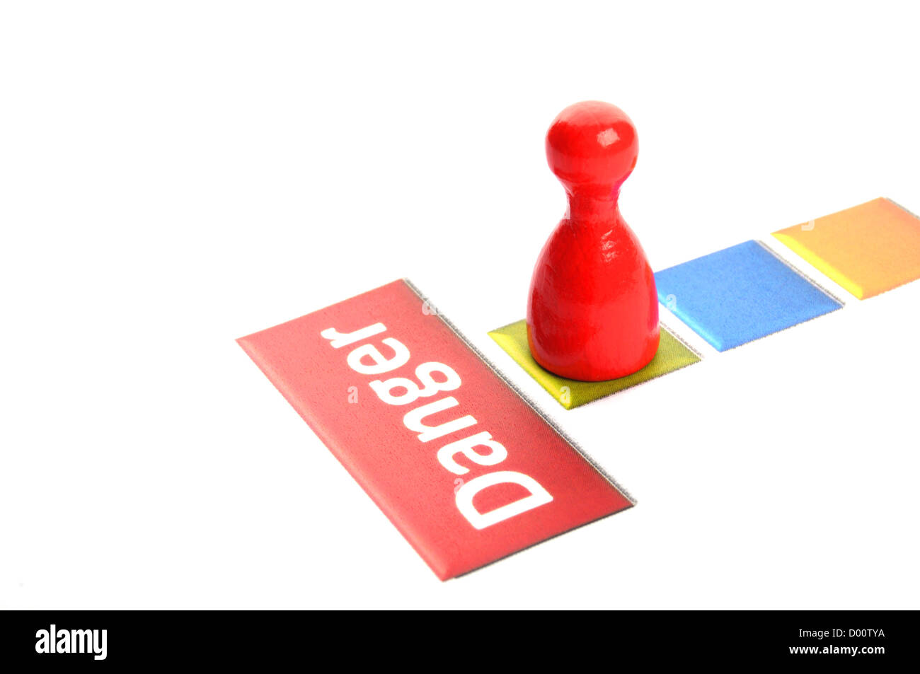 danger or risk ahead concept with pawn in white Stock Photo - Alamy
