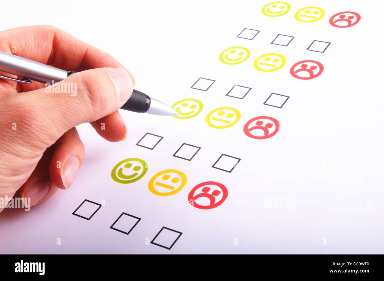 hand pen and checkbox or tickbox with smilie Stock Photo - Alamy