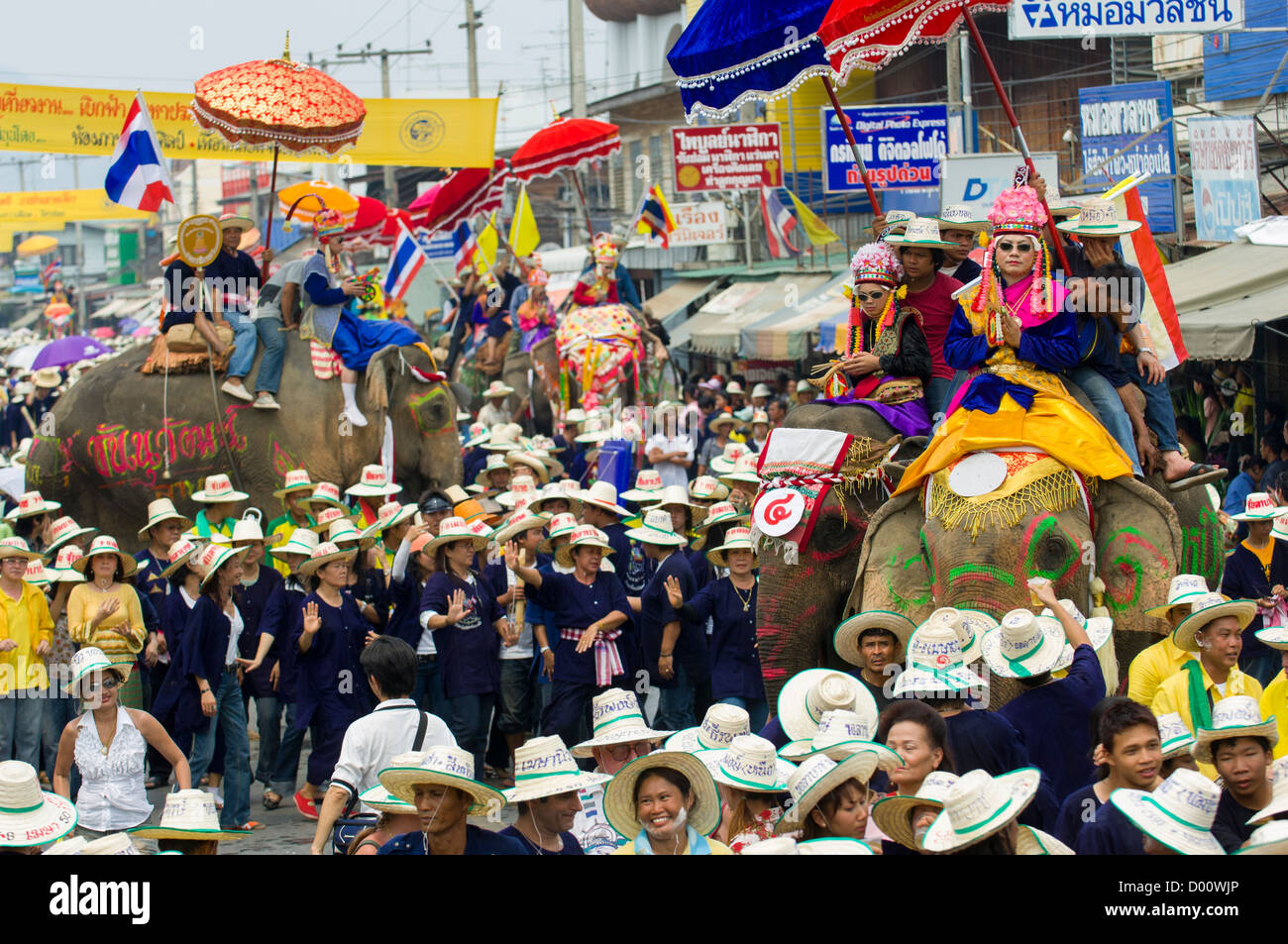 Initiates dressed in garish costumes and sunglasses in procession on ...