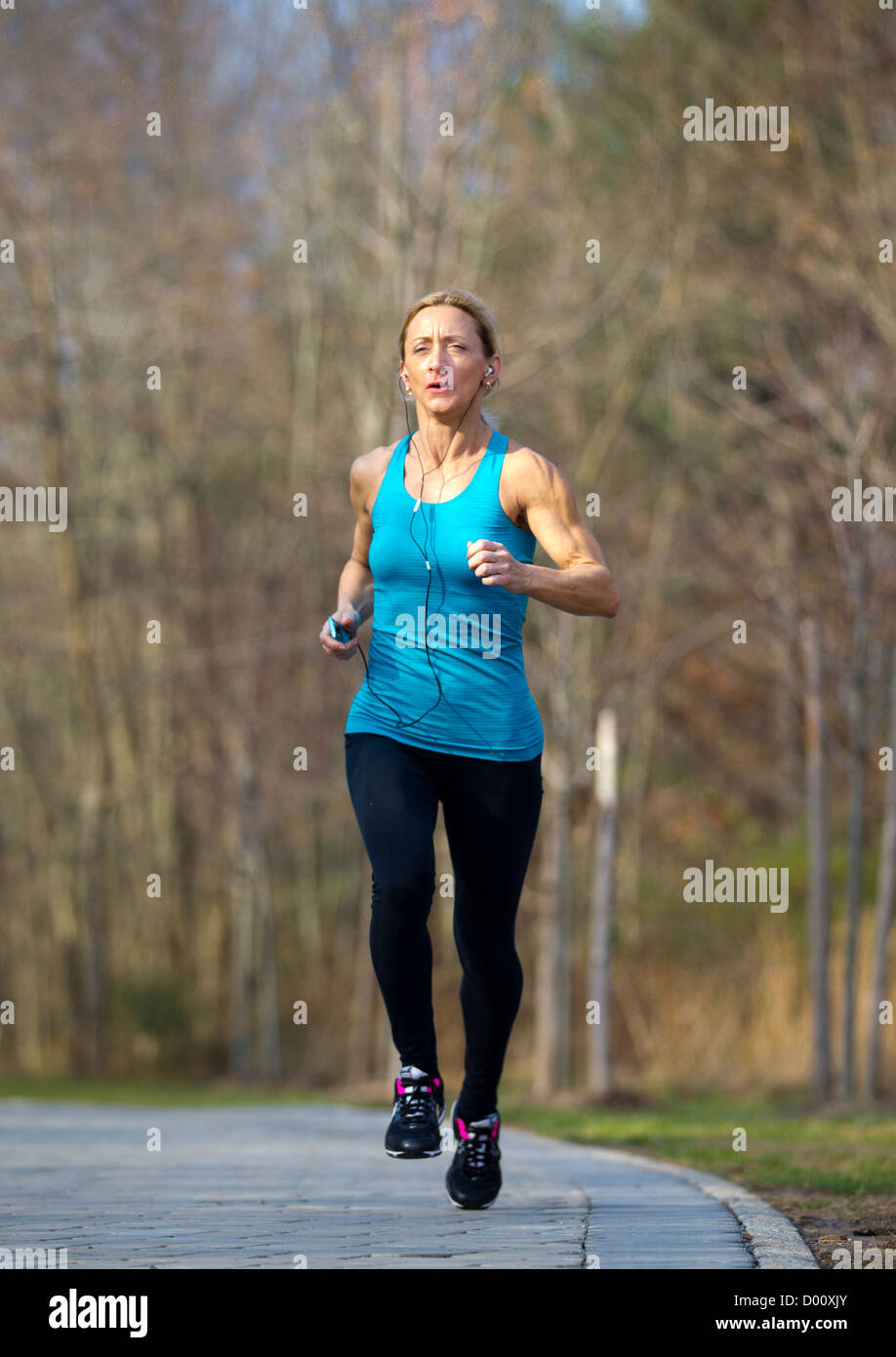 Fit woman jogging on a path Stock Photo - Alamy