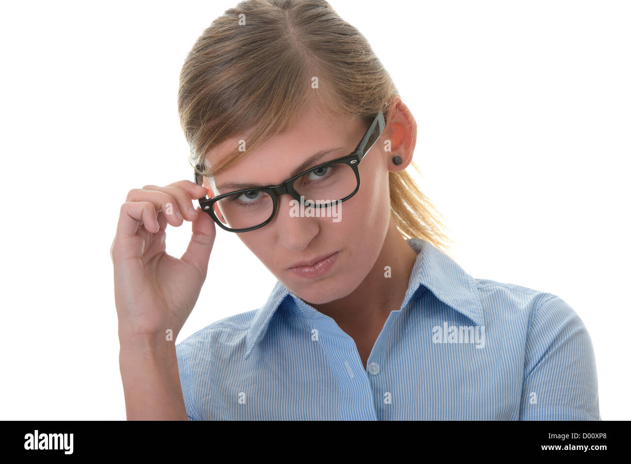 Portrait of a thoughtful young woman in blue shirt and glasses (student ...