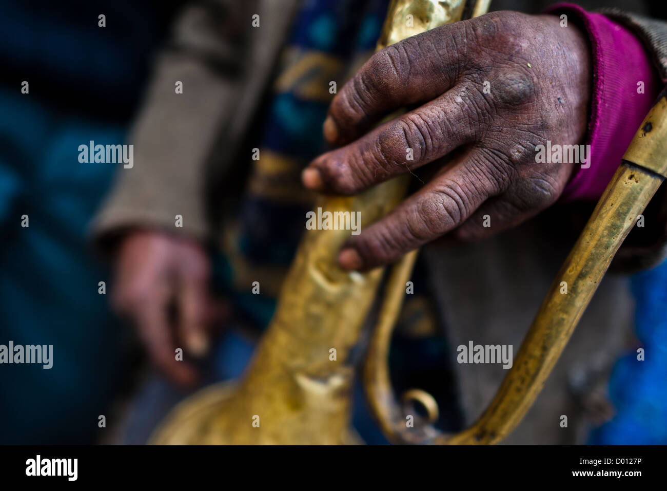 A Peruvian indigenous man holds a crumpled trumpet during the Yawar ...
