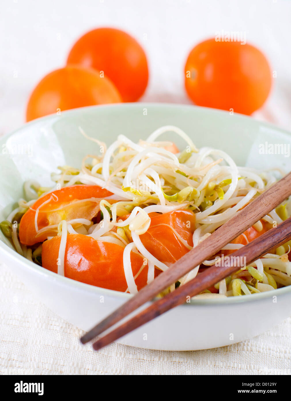 Cooked organic bean sprouts with tomatoes Stock Photo - Alamy