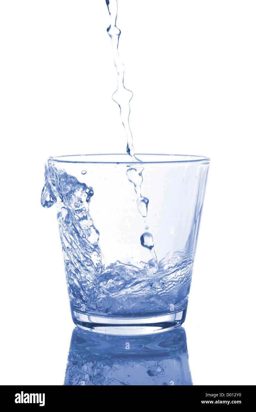 splashing water pouring in a glass with bubbles Stock Photo - Alamy