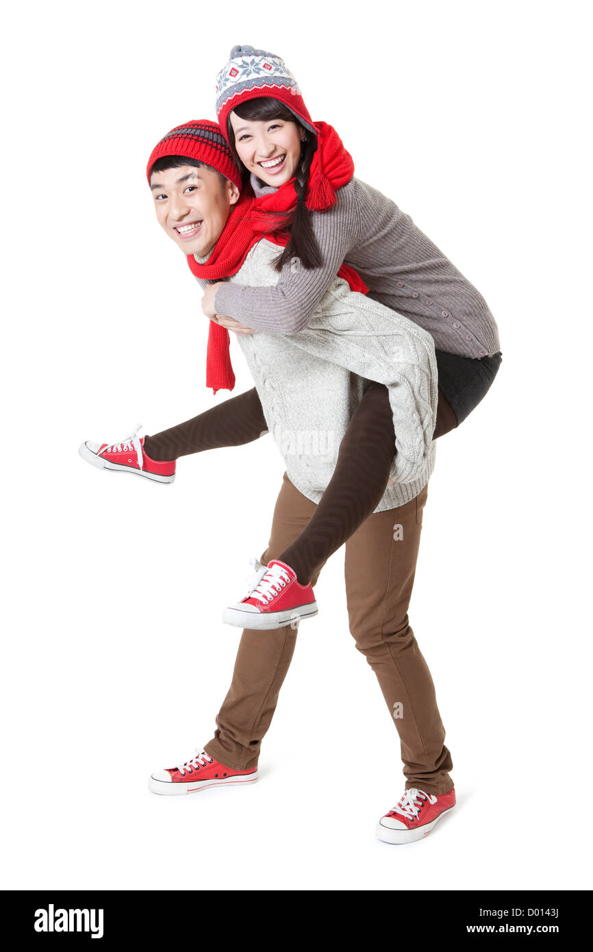 Lovely young couple doing piggyback in Chinese New Year Stock Photo - Alamy