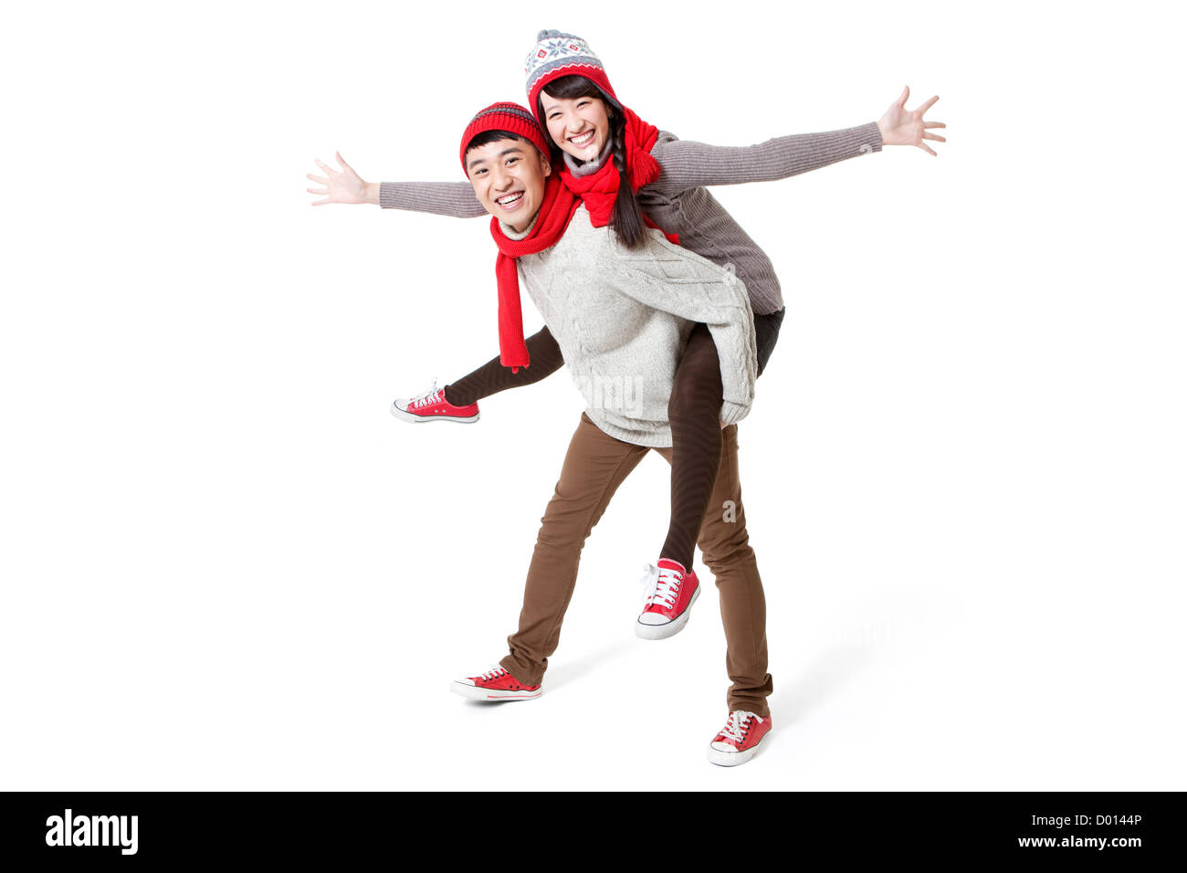 Lovely young couple doing piggyback in Chinese New Year Stock Photo - Alamy