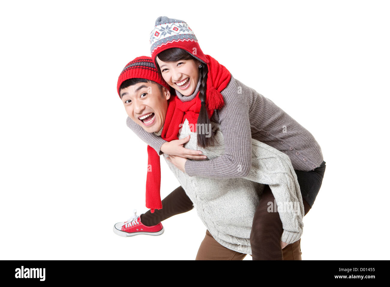 Funny young couple doing piggyback in Chinese New Year Stock Photo - Alamy