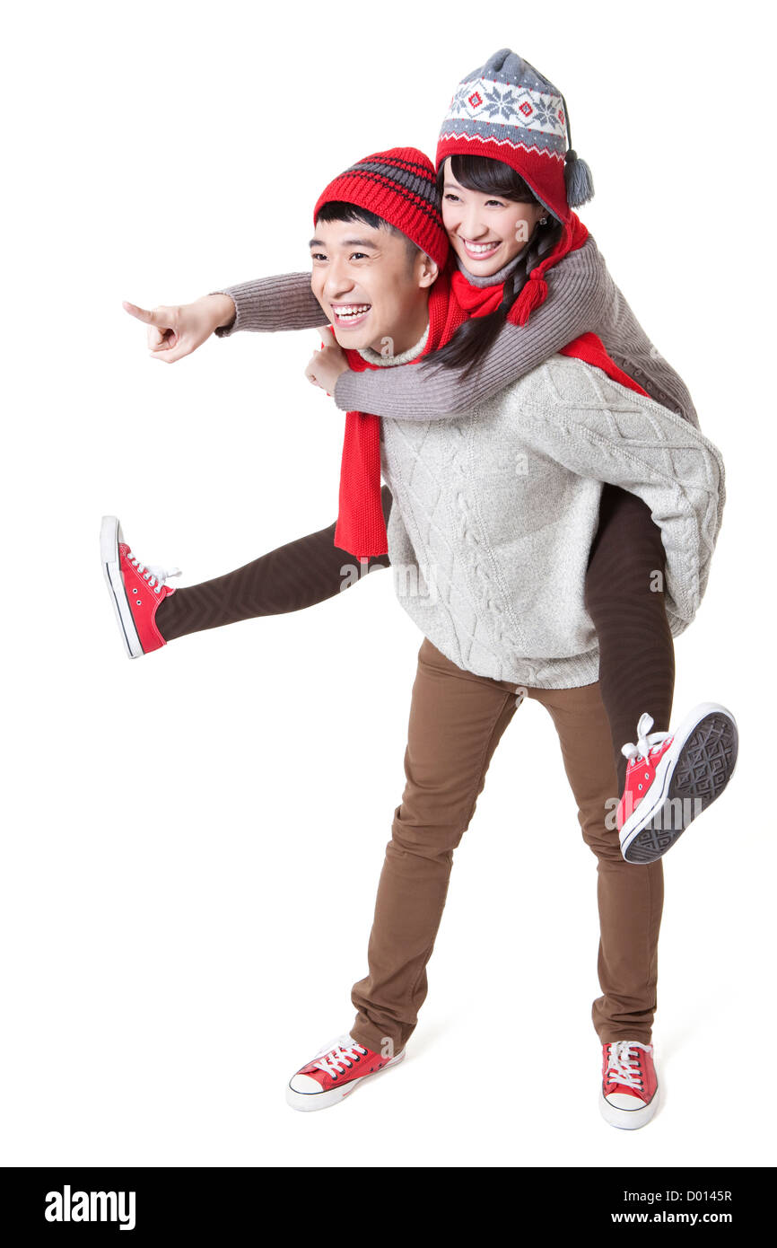 Young couple doing piggyback in Chinese New Year Stock Photo - Alamy