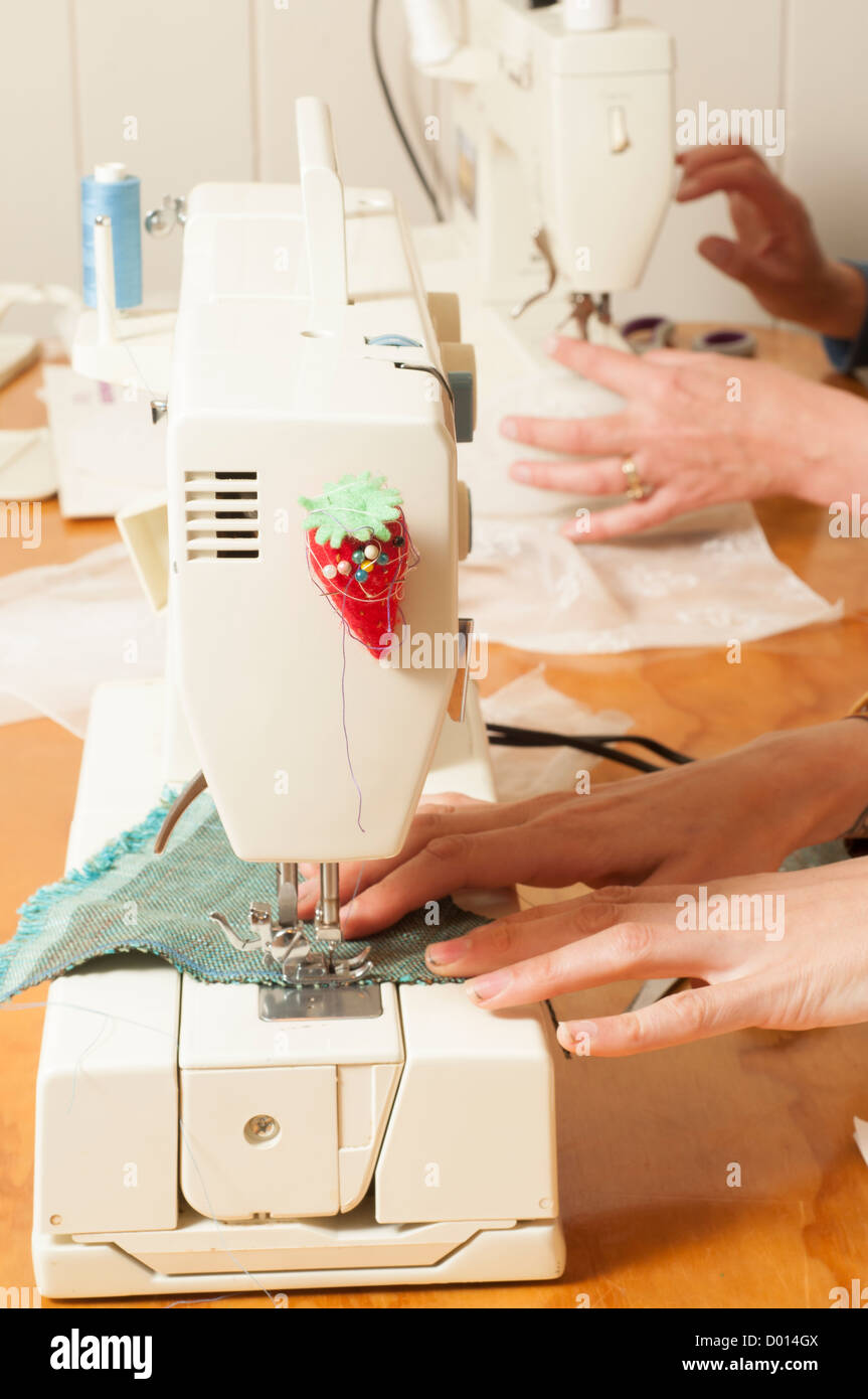 soweing machine with hands Stock Photo - Alamy