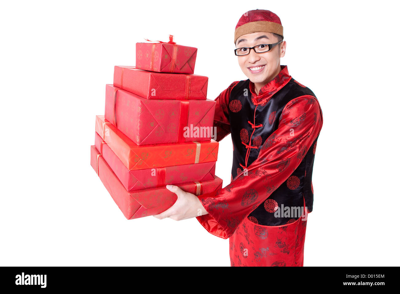 Cheerful young man in Tang suit holding gift boxes Stock Photo - Alamy