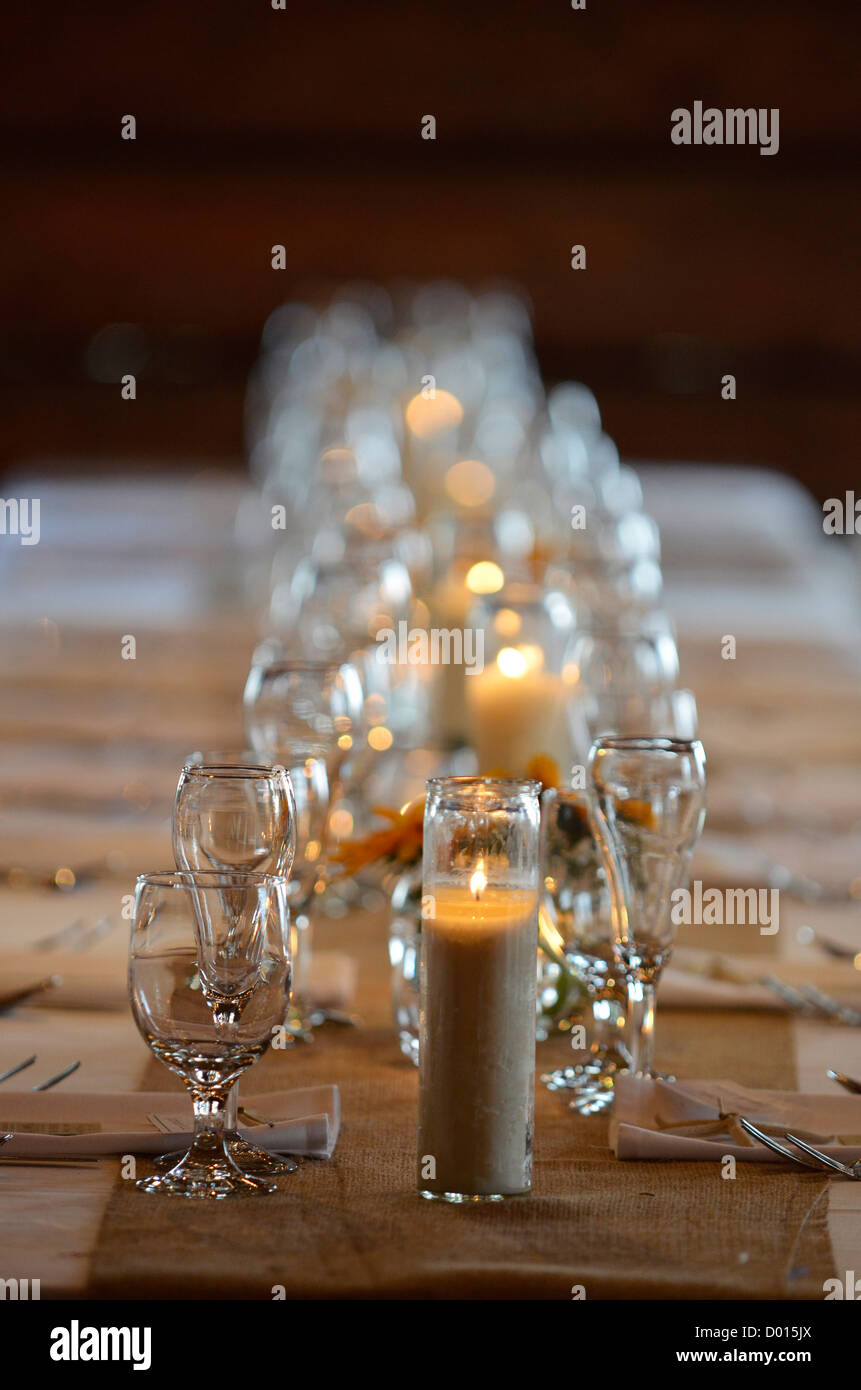 Table setting with lit candles Stock Photo - Alamy