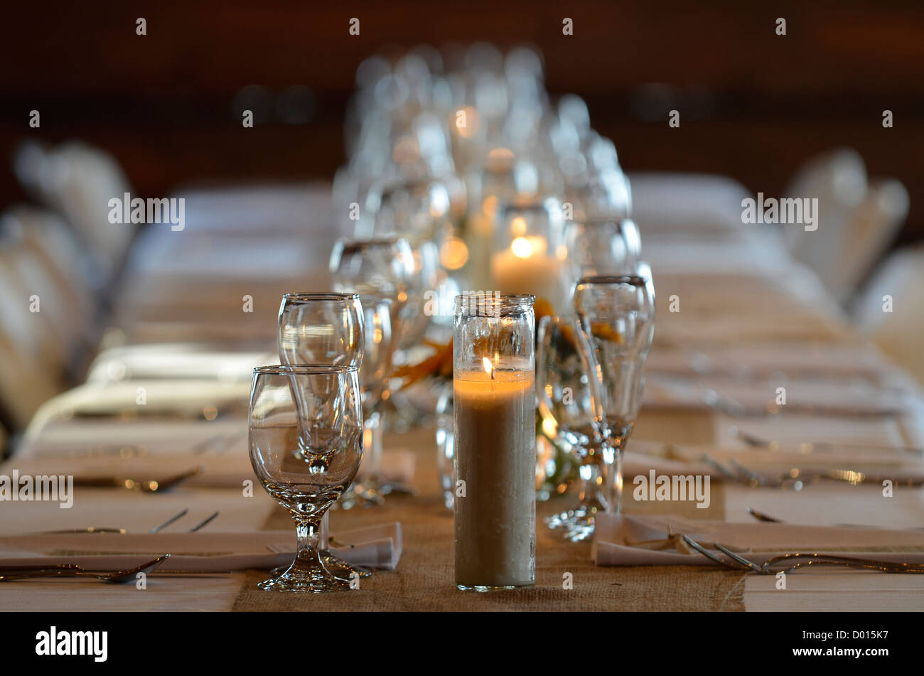 Table setting with lit candles Stock Photo - Alamy