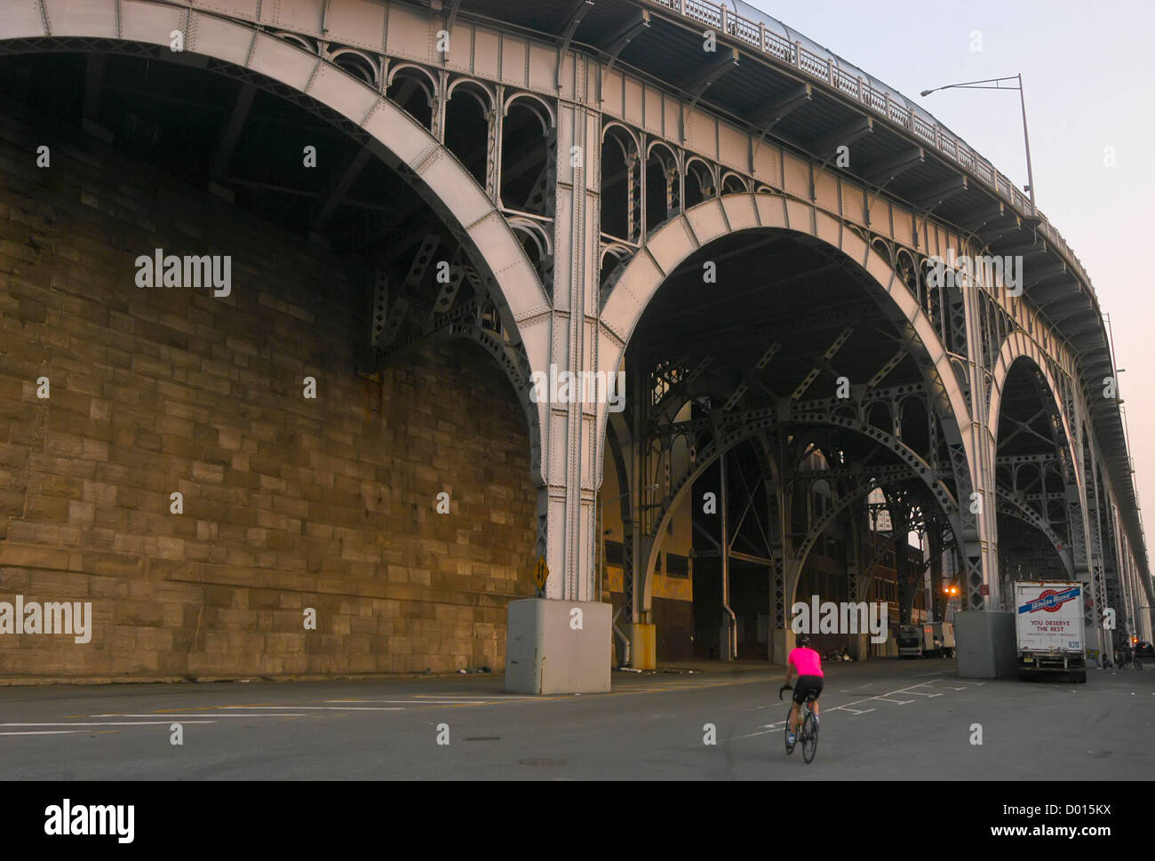 Cyclist rides under the Riverside Viaduct on the West Side Bike Path ...