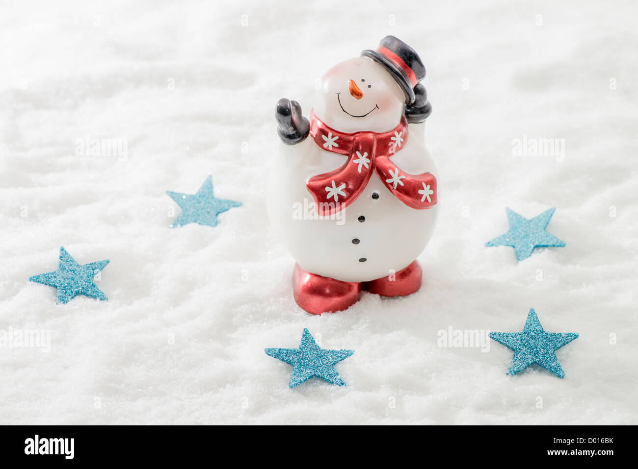 Snowman and stars Christmas decoration on snow Stock Photo - Alamy
