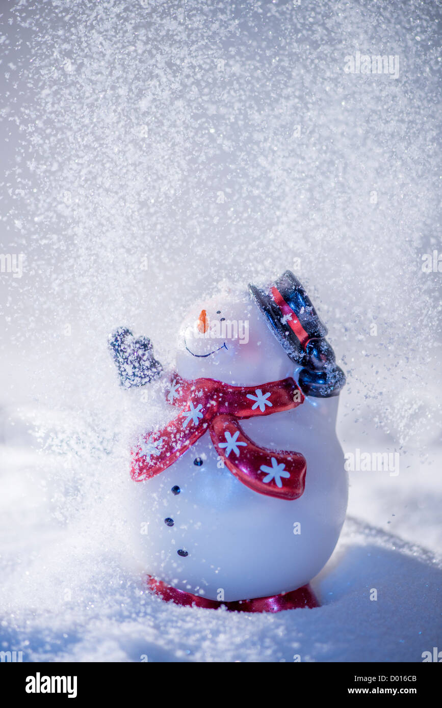 Smiling snowman in snow storm. Copy space Stock Photo - Alamy
