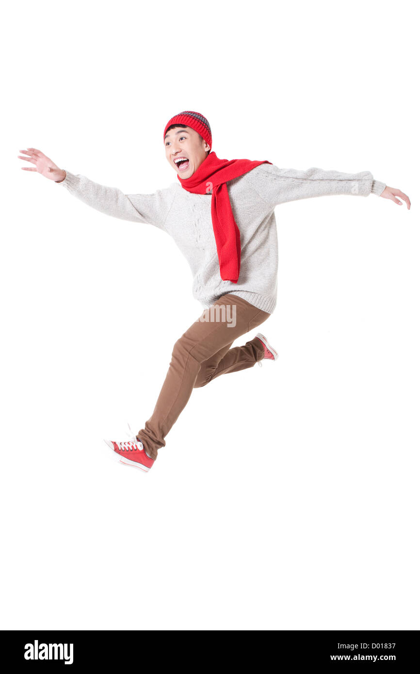Excited young man running forward Stock Photo - Alamy