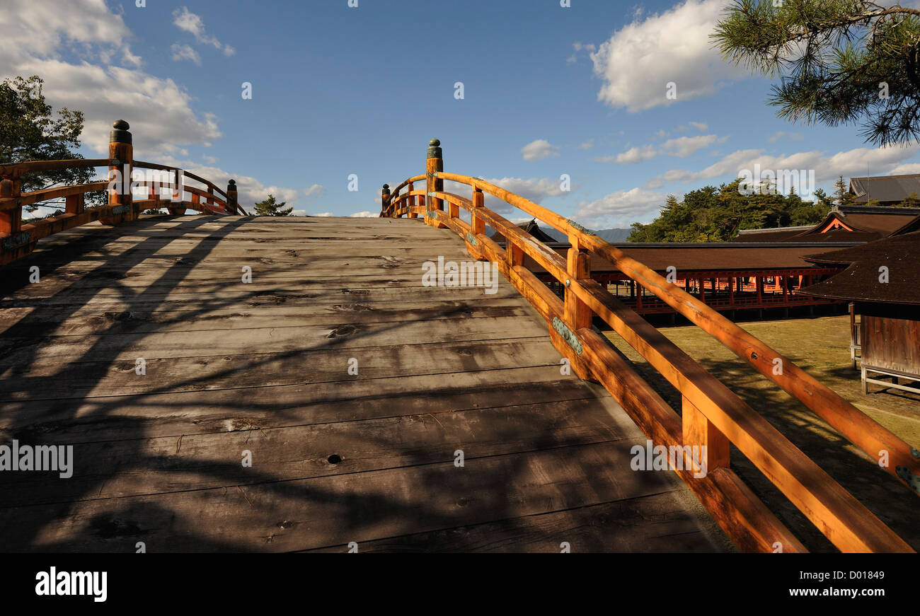 wooden arched bridge at Itsukushima shrine on the island of Miyajima ...