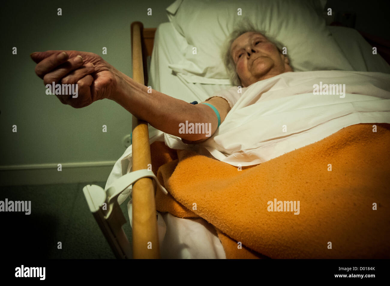 An old sick lady in her bed Stock Photo - Alamy