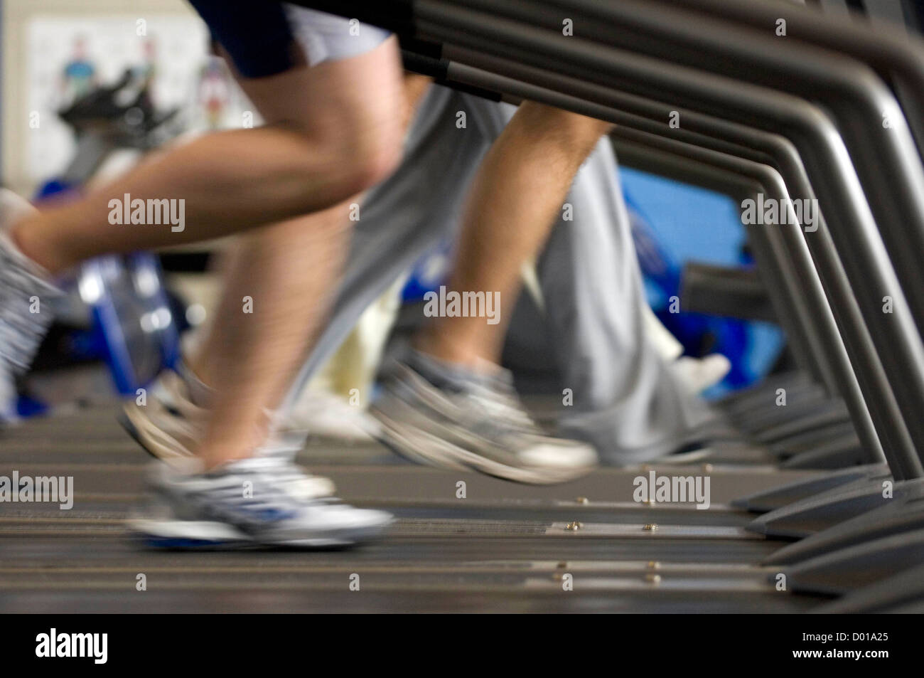 People using a running machine / treadmill in health club Stock Photo ...