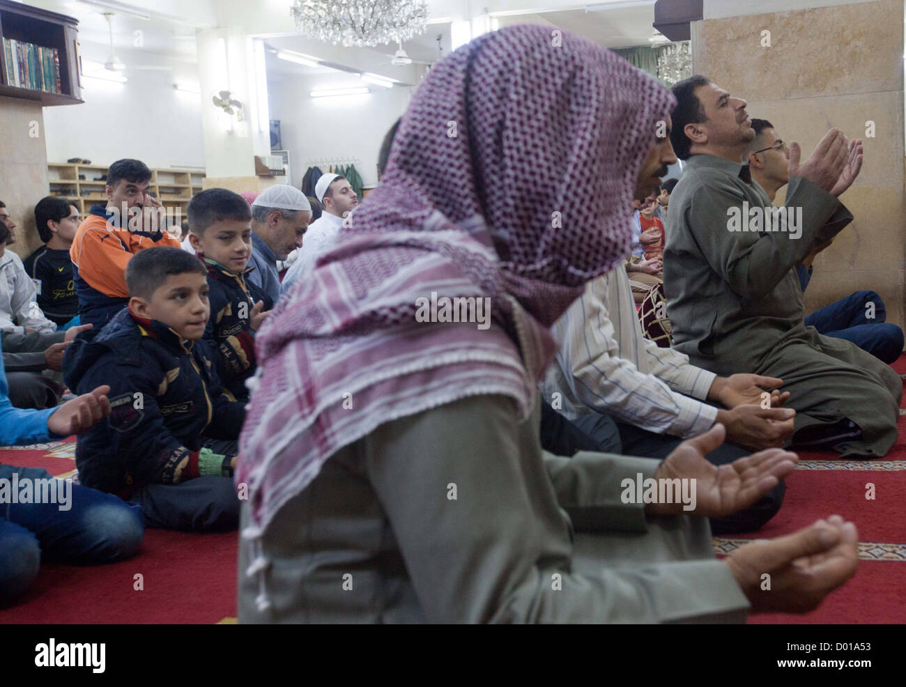 People attend morning prayers on ei hi-res stock photography and images ...