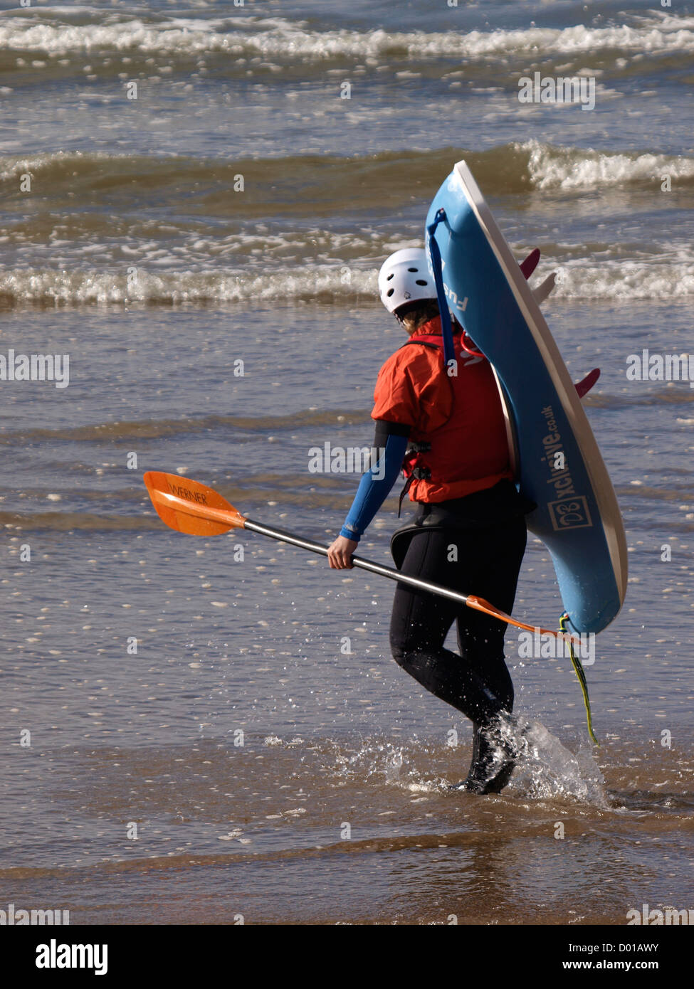 Sea kayaker carrying kayak to the sea, Cornwall, UK Stock Photo - Alamy