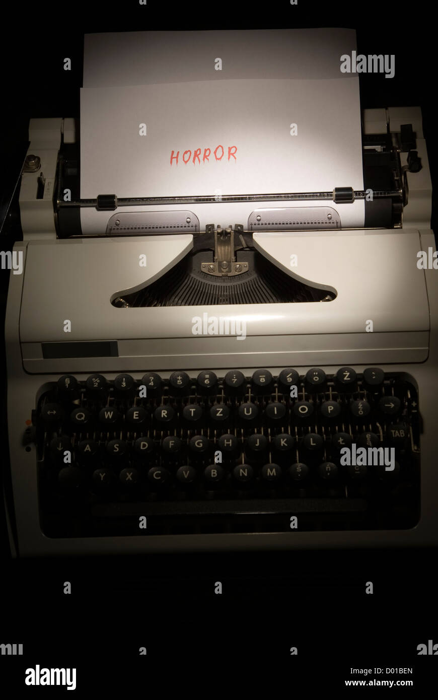 typing machine and paper with inscription horror Stock Photo - Alamy