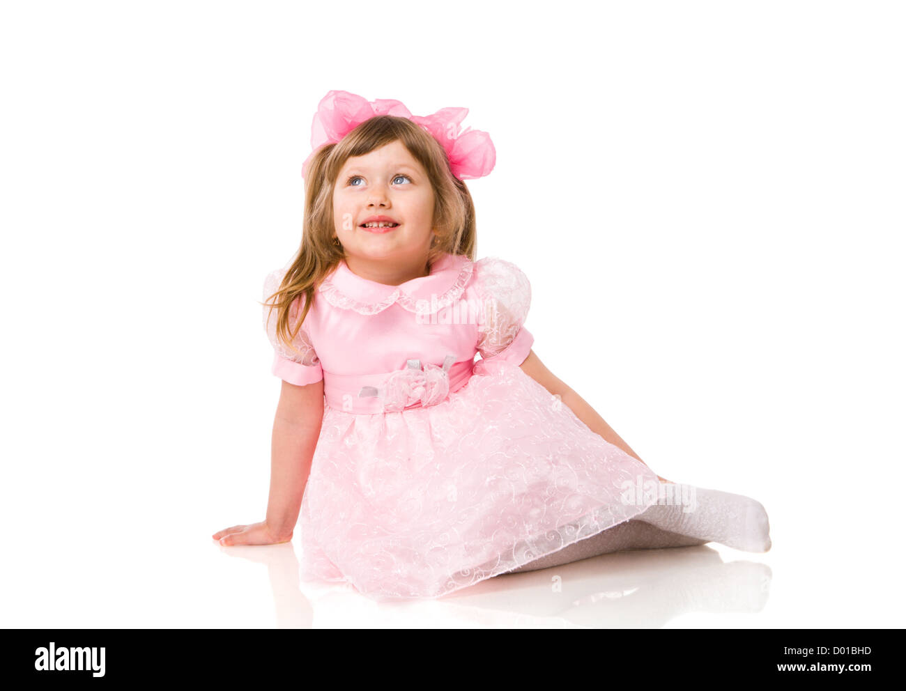 Happy girl wearing pink dress isolated on white Stock Photo - Alamy