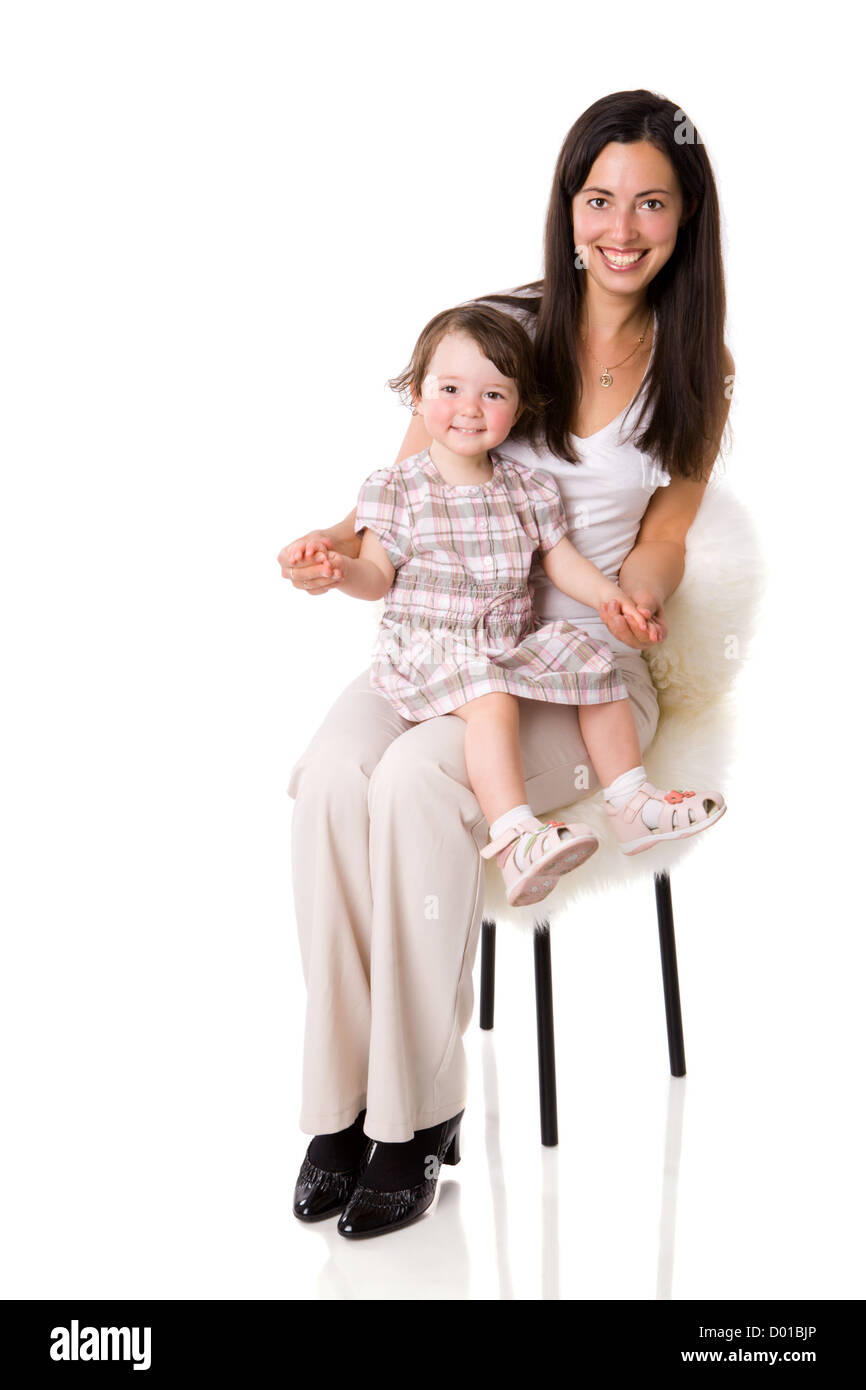 Mother with daughter sitting on chair isolated on white Stock Photo - Alamy