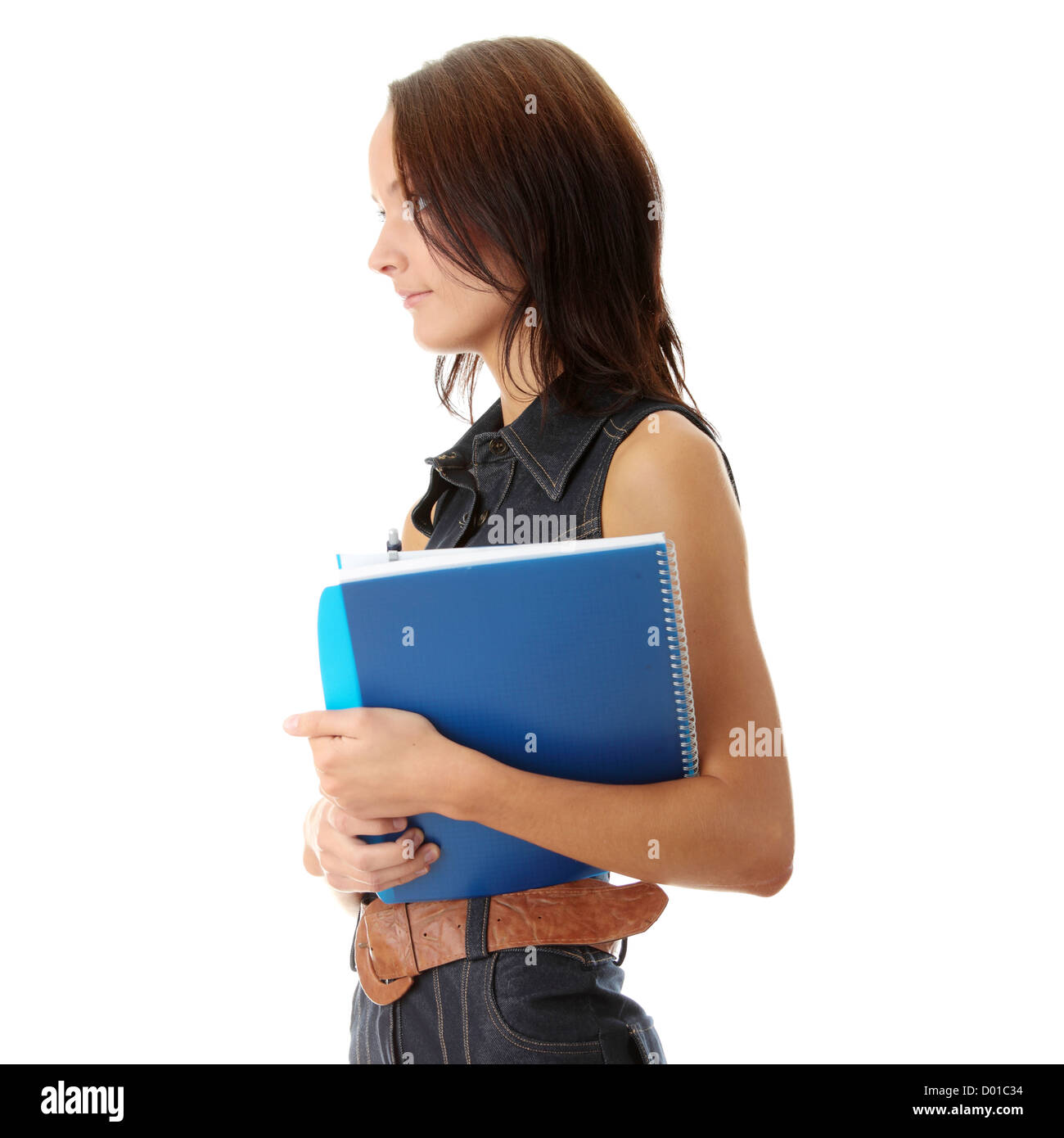 Female university student smiling and carrying some notebooks ...