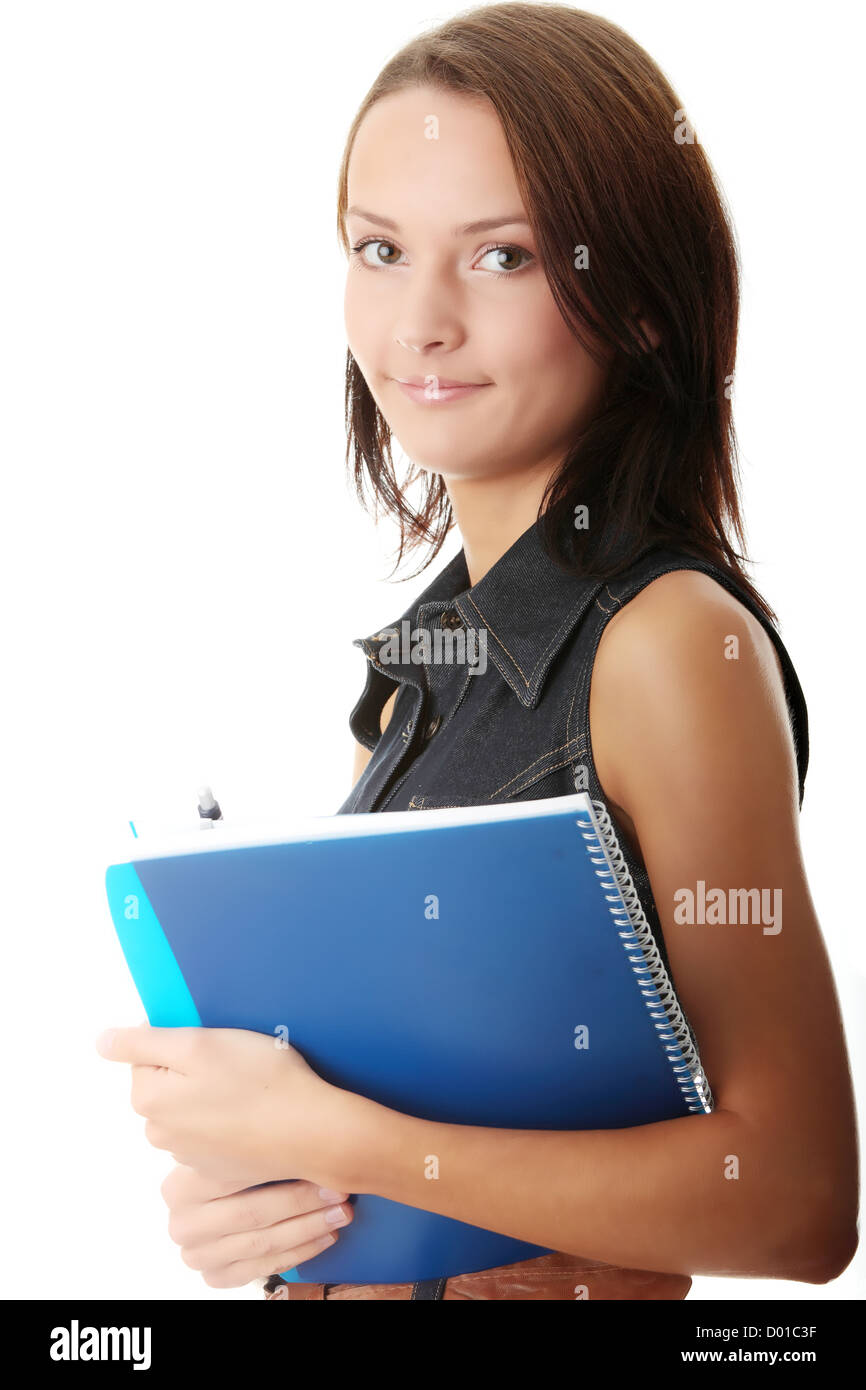 Female university student smiling and carrying some notebooks ...