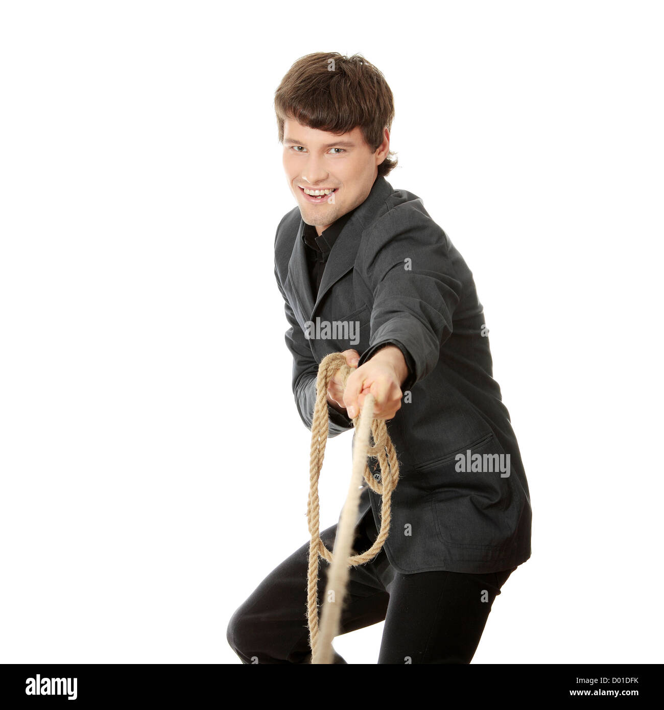 Businessman pulling on a rope. Isolated on white Stock Photo - Alamy