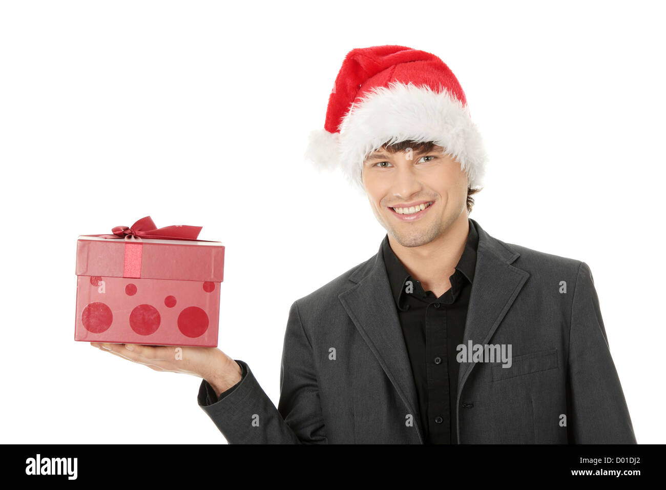 Handsome businessman offering a christmass gift. Isolated on white ...