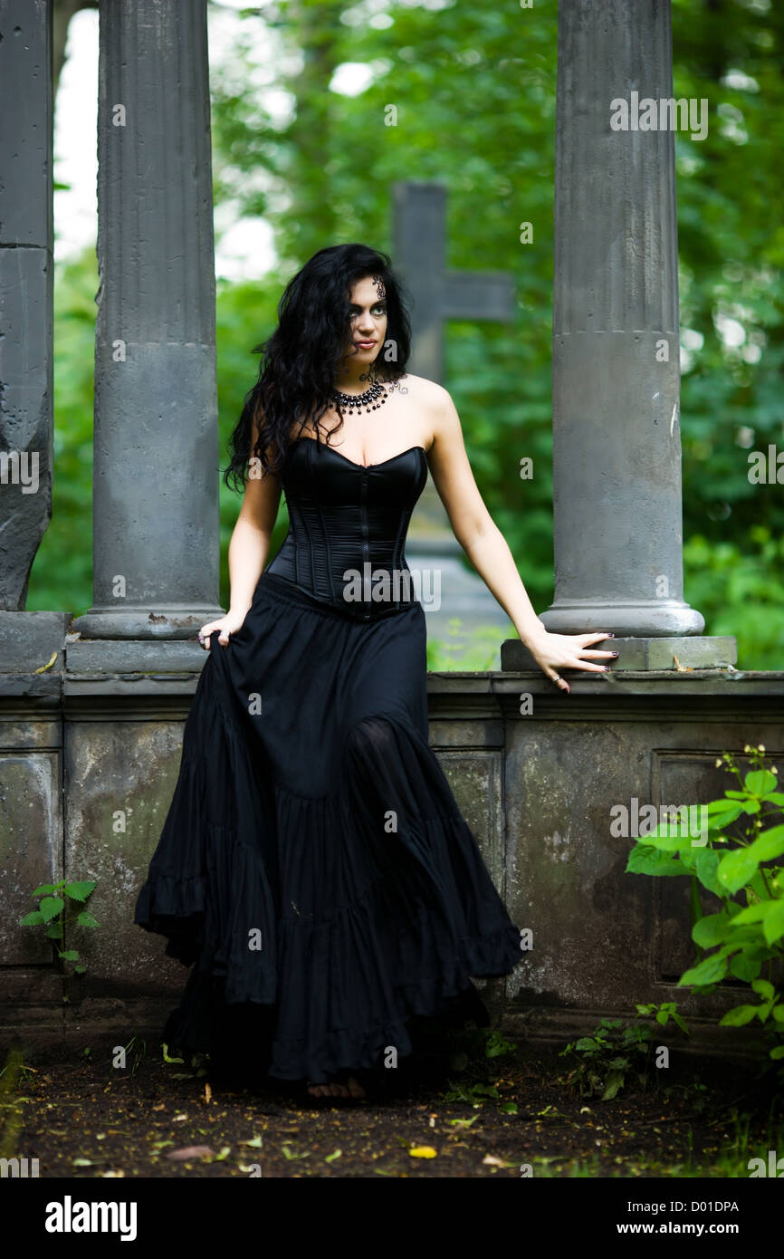 Young beautiful demonic female creature walking through the night Stock ...