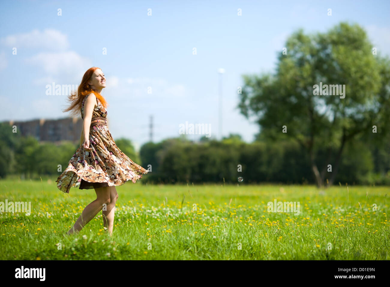 Young woman dancing happy in summer meadow Stock Photo - Alamy