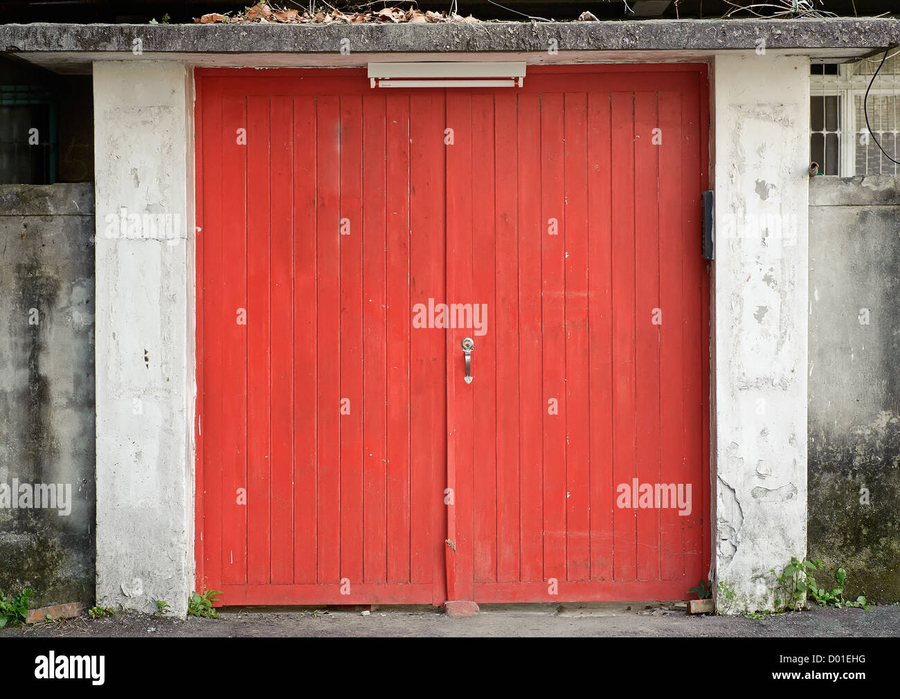 Old door in red color, desolate building exterior Stock Photo - Alamy