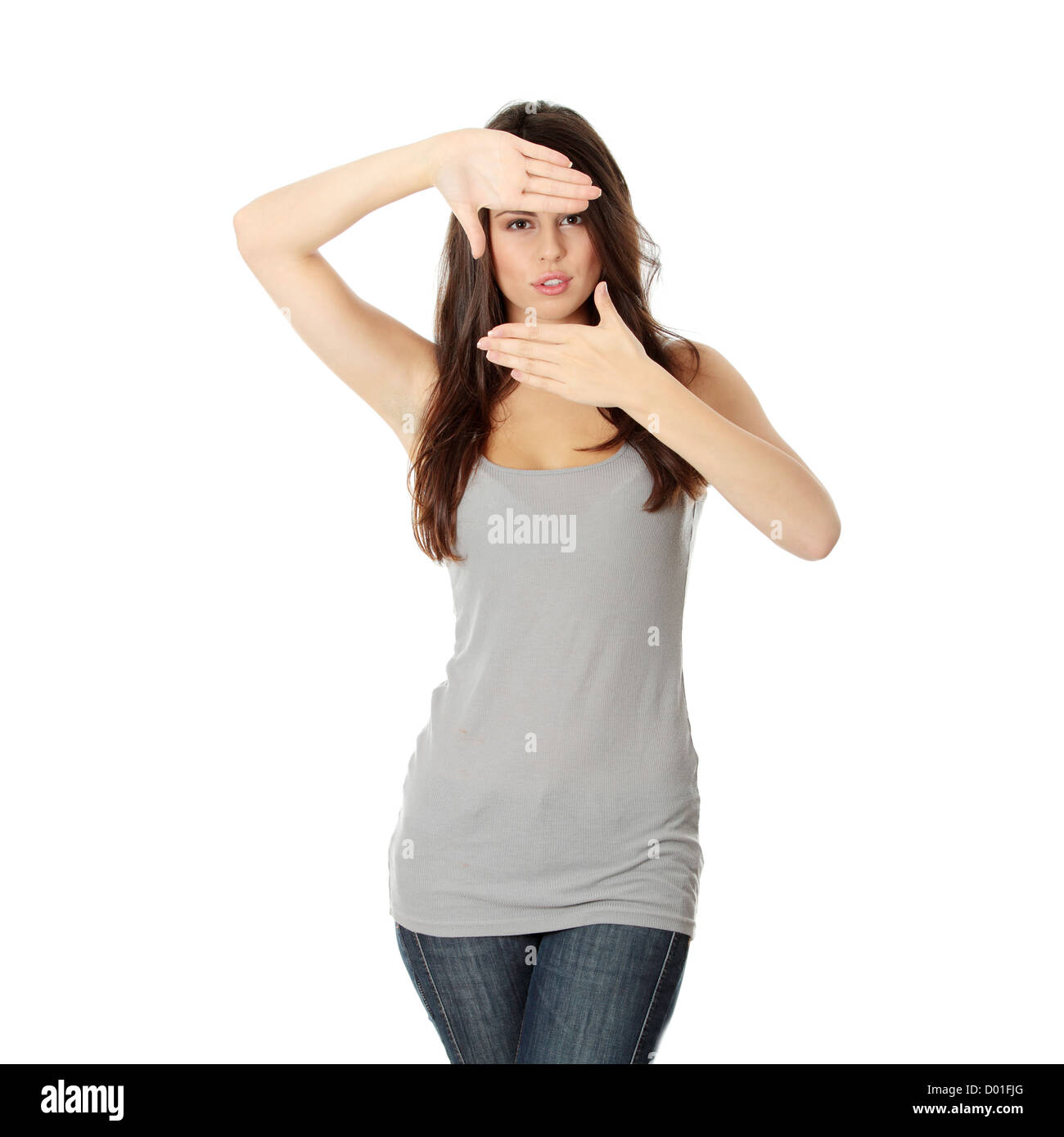 Woman framing her face with hands Stock Photo - Alamy