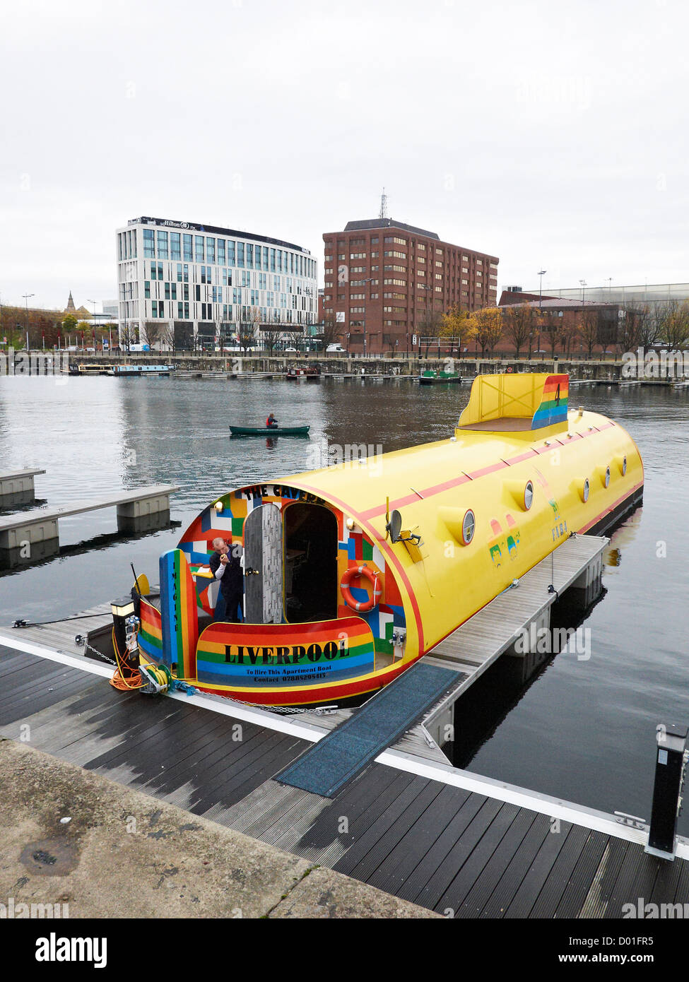 Yellow submarine build on a narrow boat, for rent as a hotel, in the ...