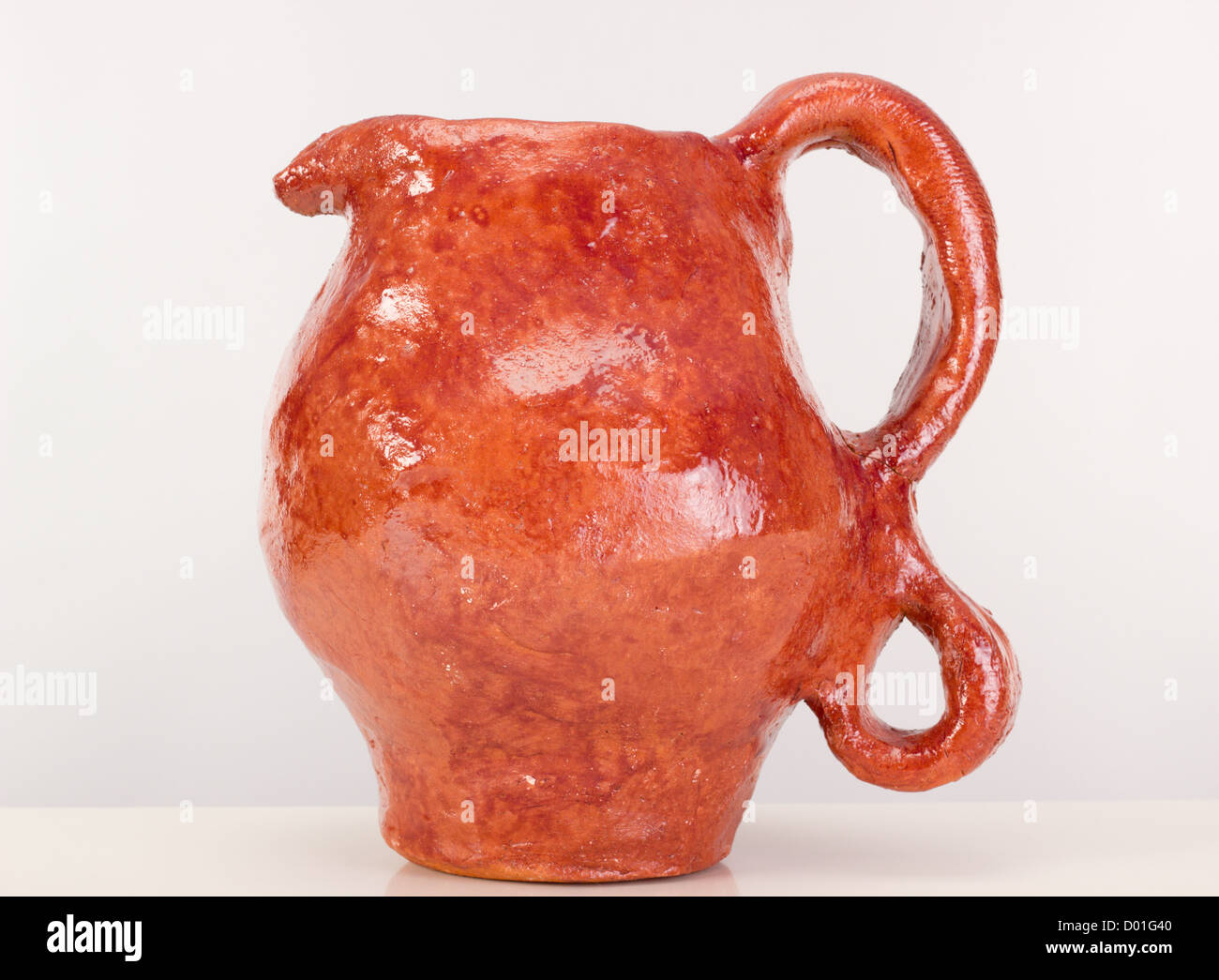 A clay jug on a table Stock Photo - Alamy