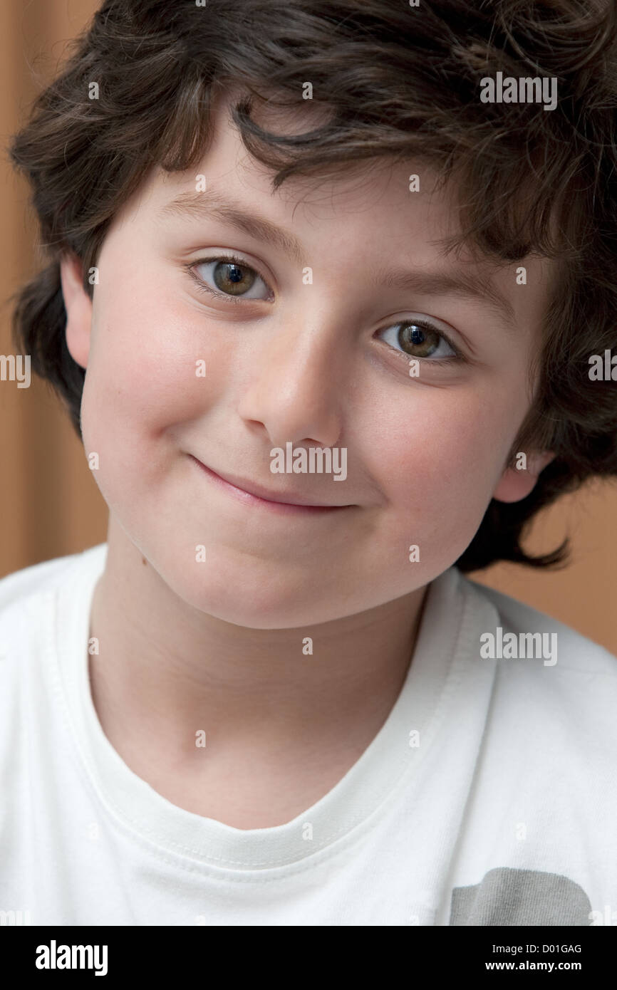 Adorable and beautiful child with white shirt smiling Stock Photo - Alamy