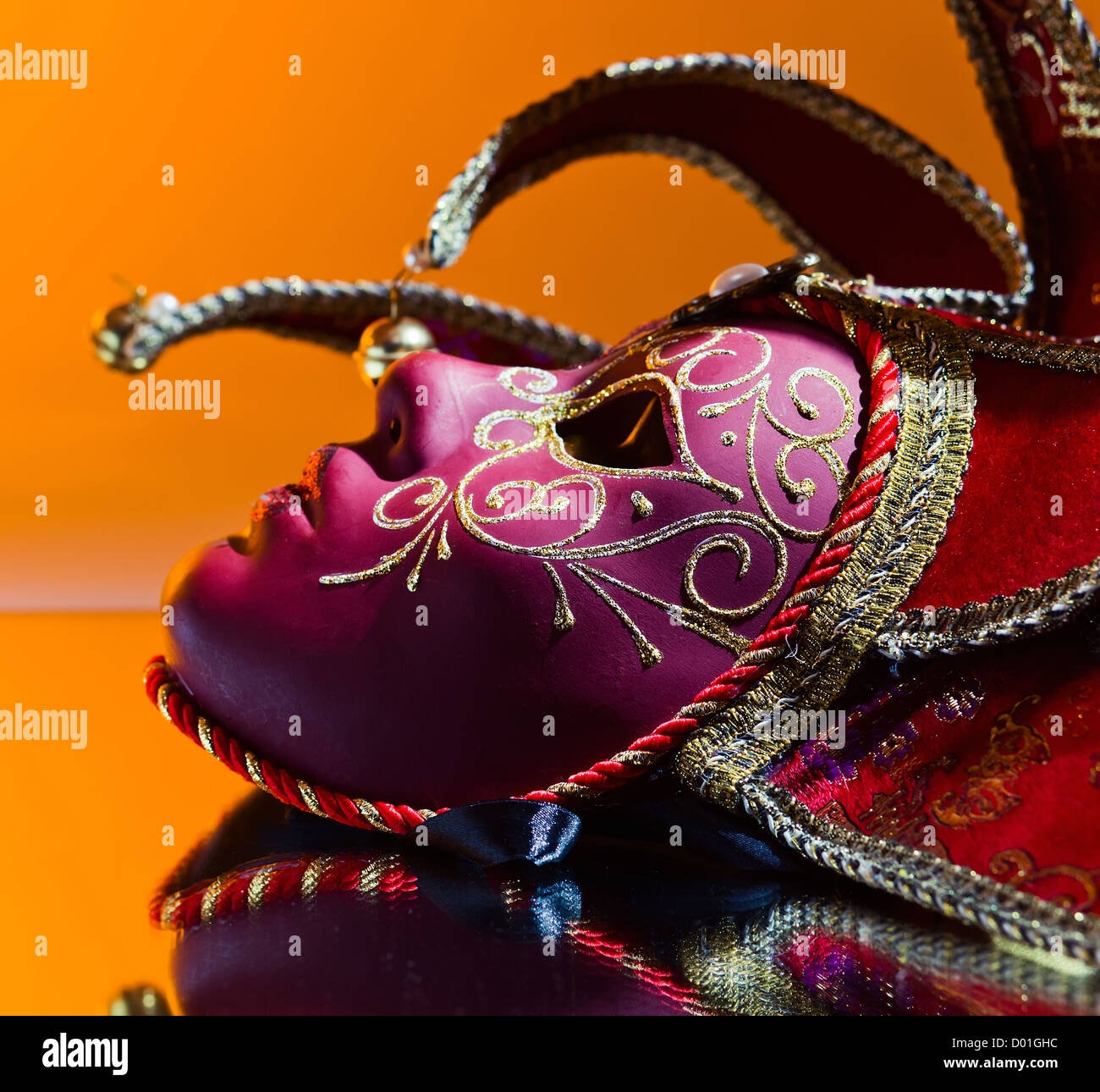 The Venetian mask with bells on a mirror table Stock Photo - Alamy