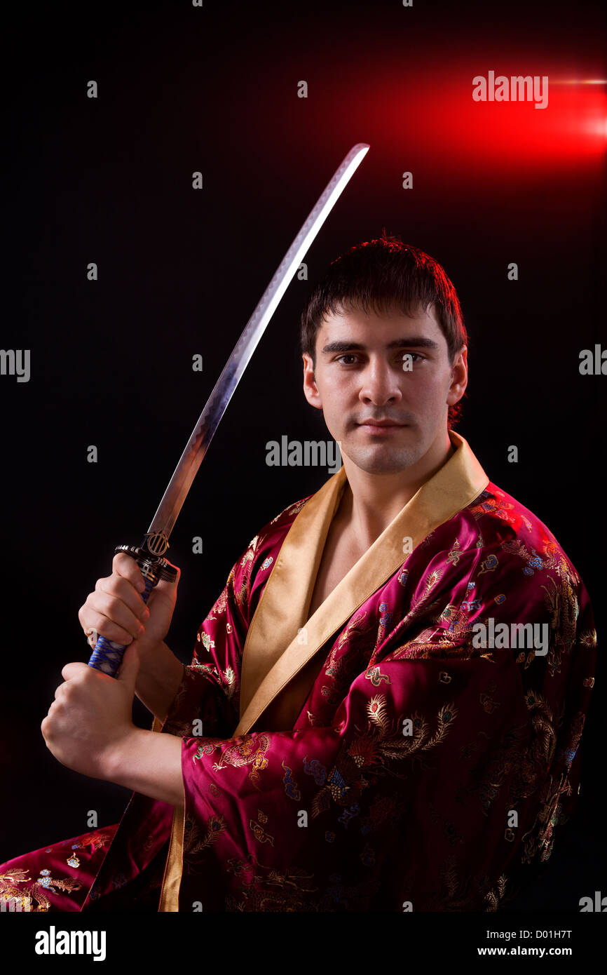 Man holding sword hi-res stock photography and images - Alamy