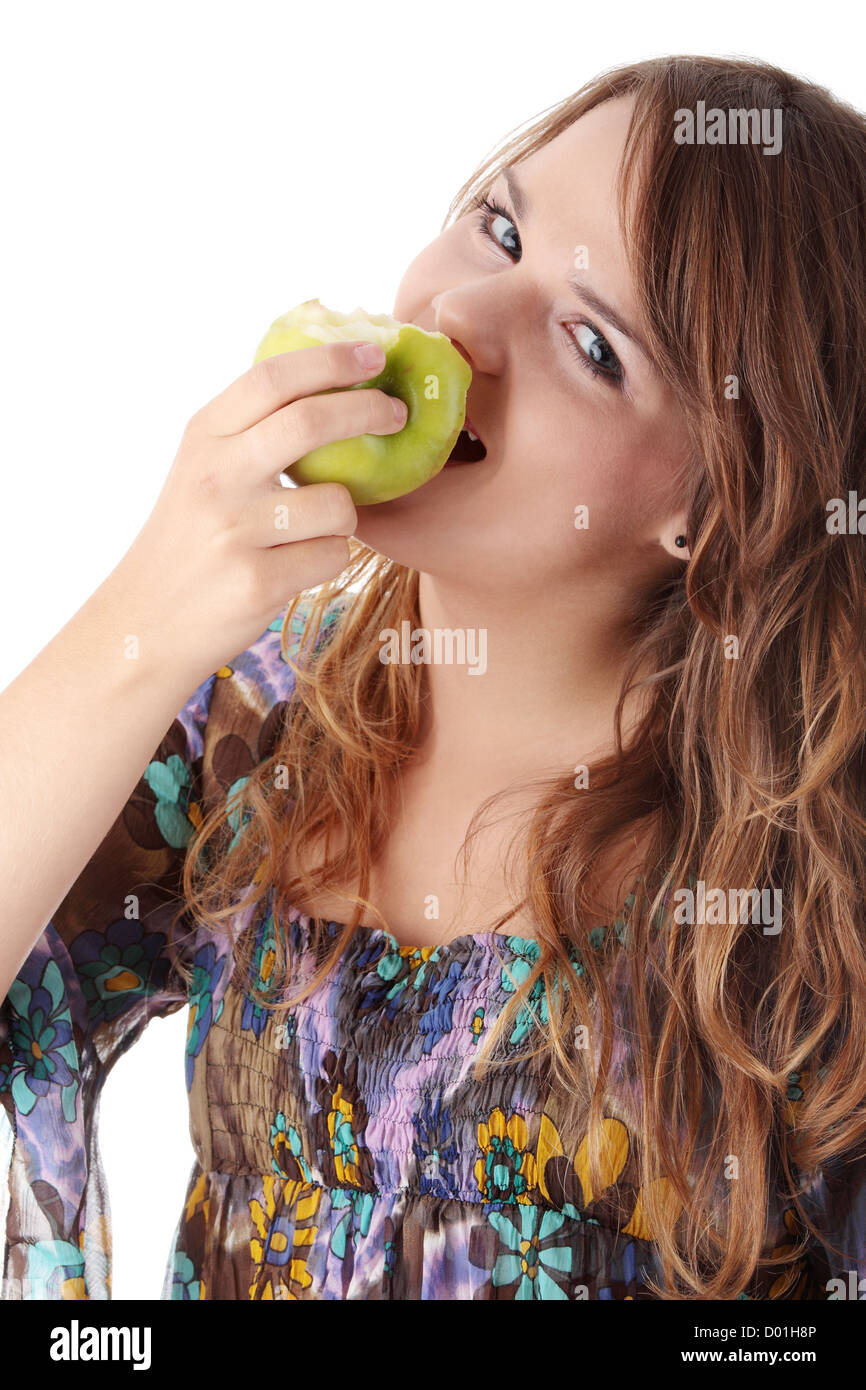 Teen girl eating grean apple isolated on white background Stock Photo ...