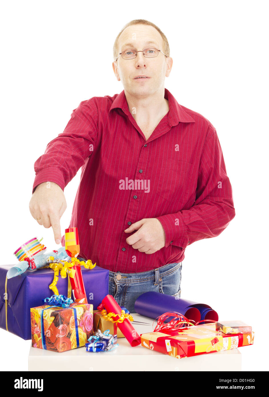 Person packaging some colorful gifts Stock Photo - Alamy