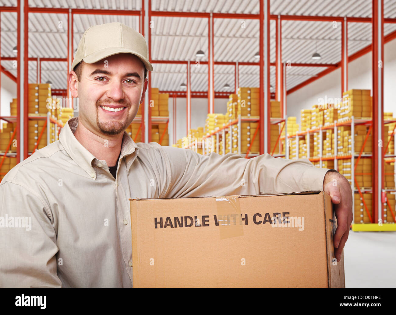 smiling delivery man in classic warehouse Stock Photo - Alamy