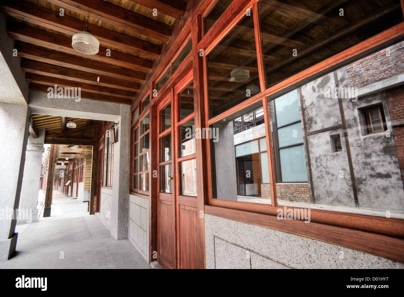 Hallway with buildings reflection on glass of windows Stock Photo - Alamy
