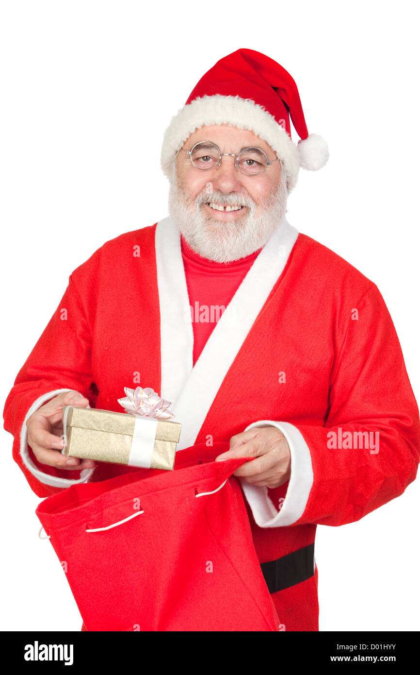 Santa Claus getting a gift from his sack isolated on white background ...